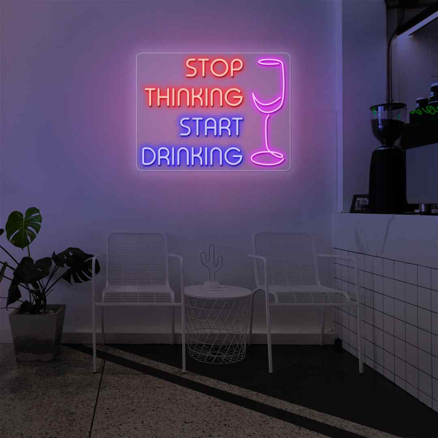 Stop thinking start drinking neon sign